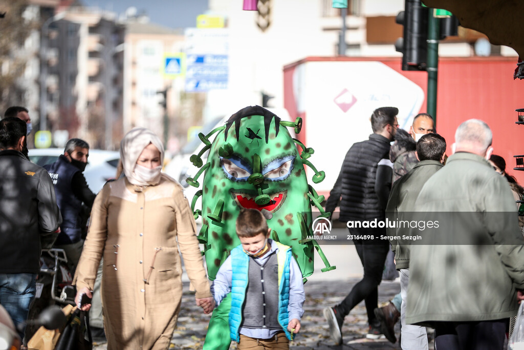 Municipality staff with Covid-19 costume in Turkey's Inegol warn ...